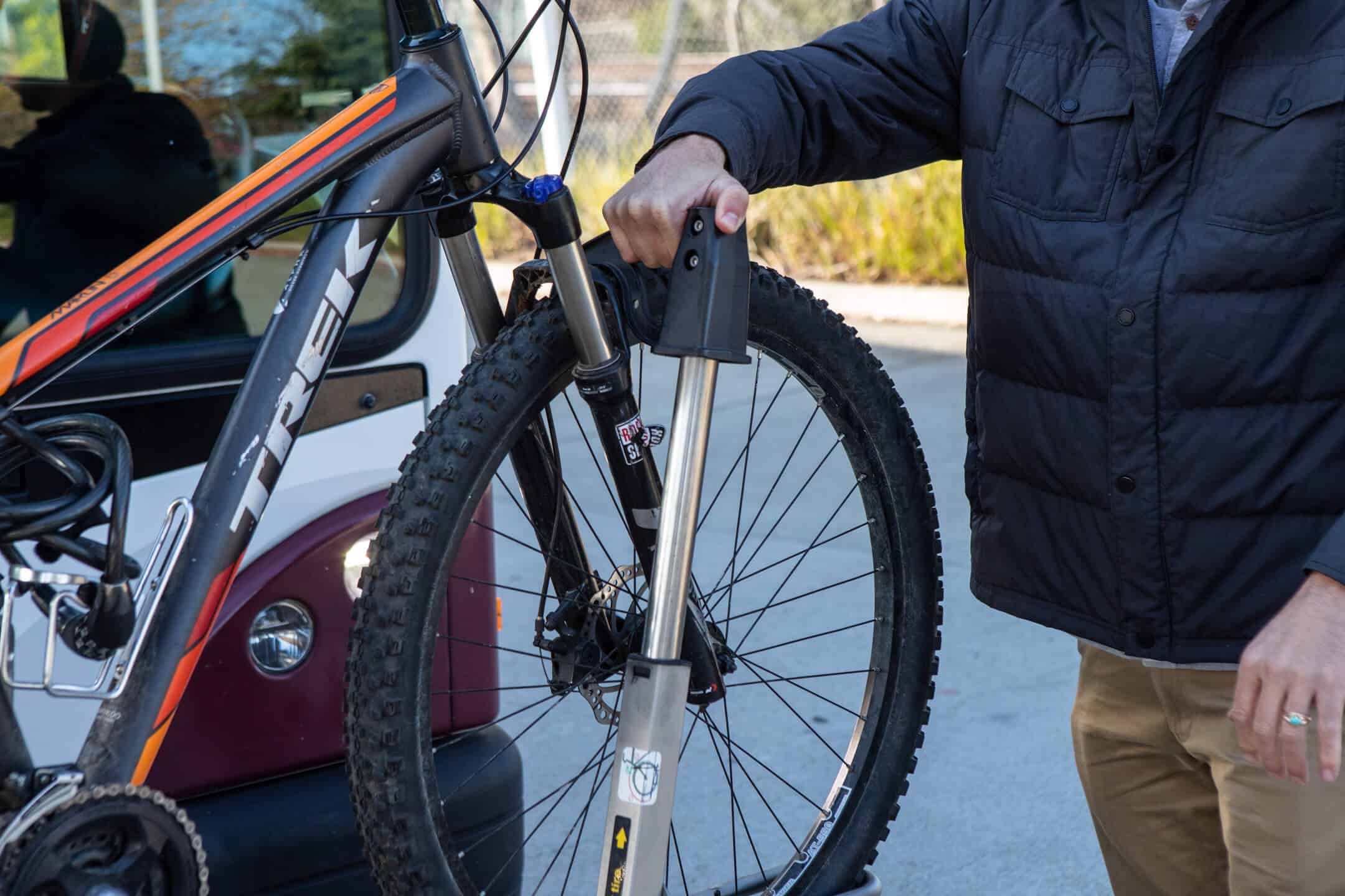 Hand adjusting bar with other hand showing 2